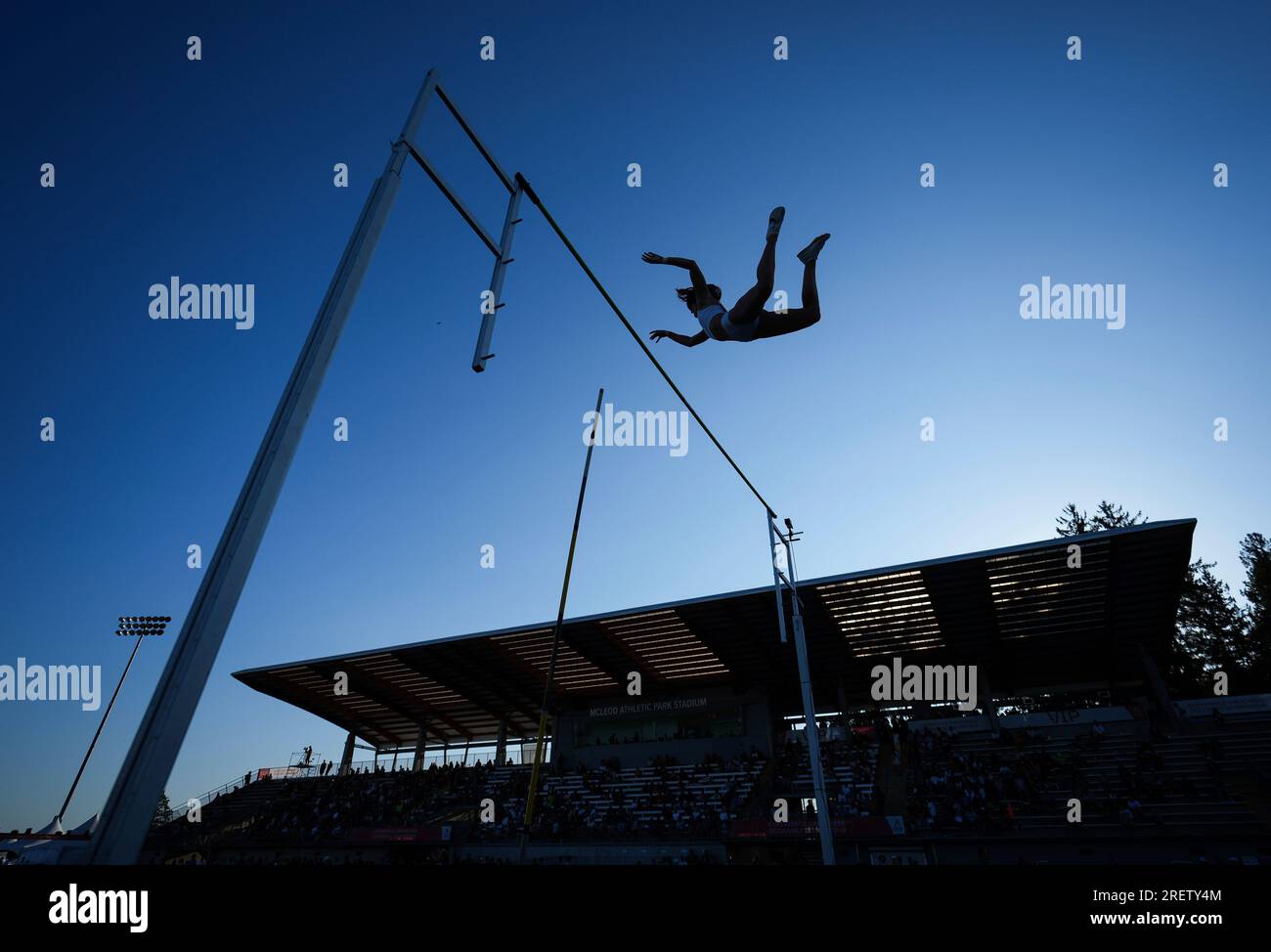 Robin Bone is silhouetted as she competes during the women's pole vault ...