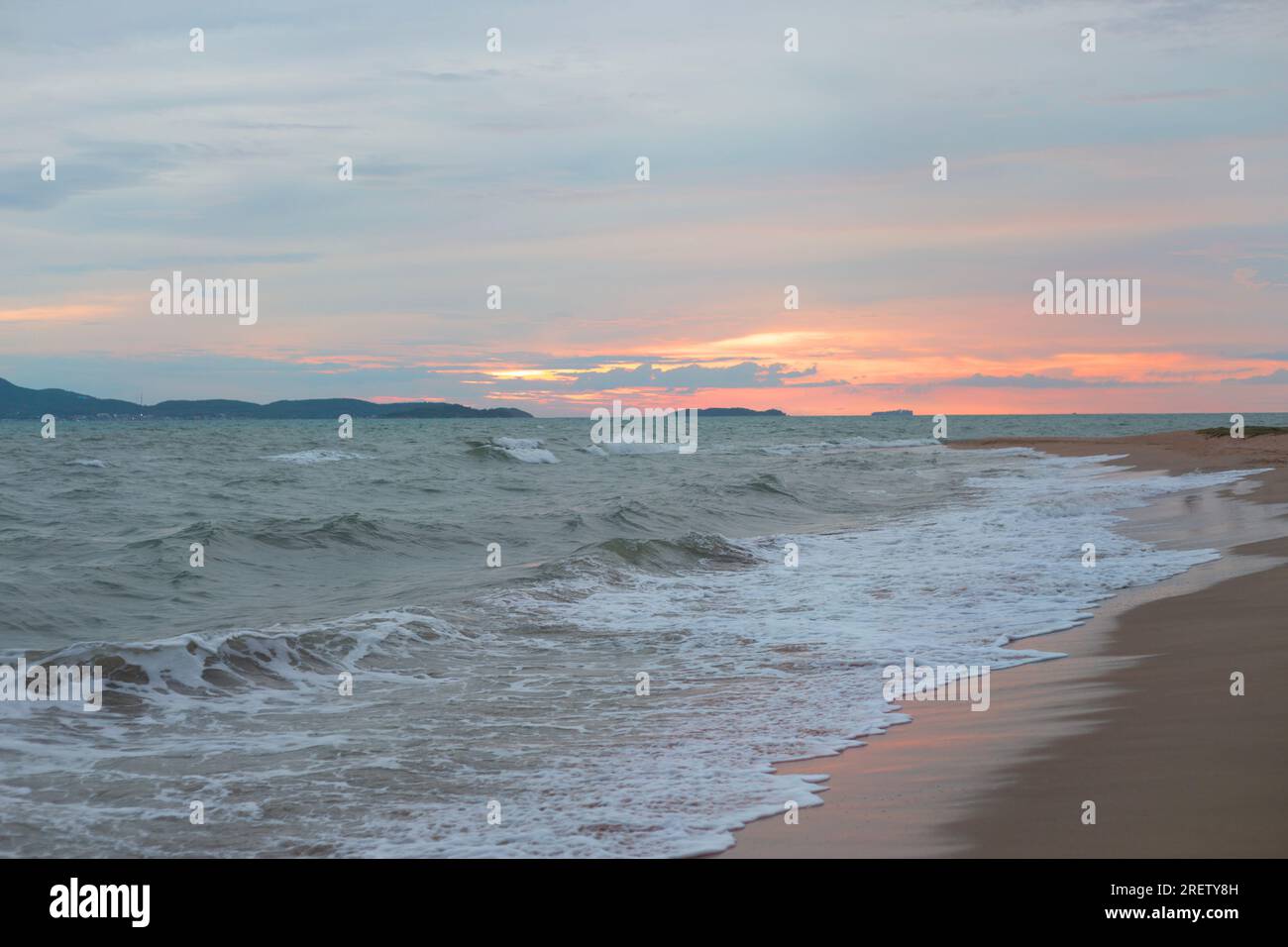Raging Sea on the Pink Sunset Sky Background Stock Photo - Alamy