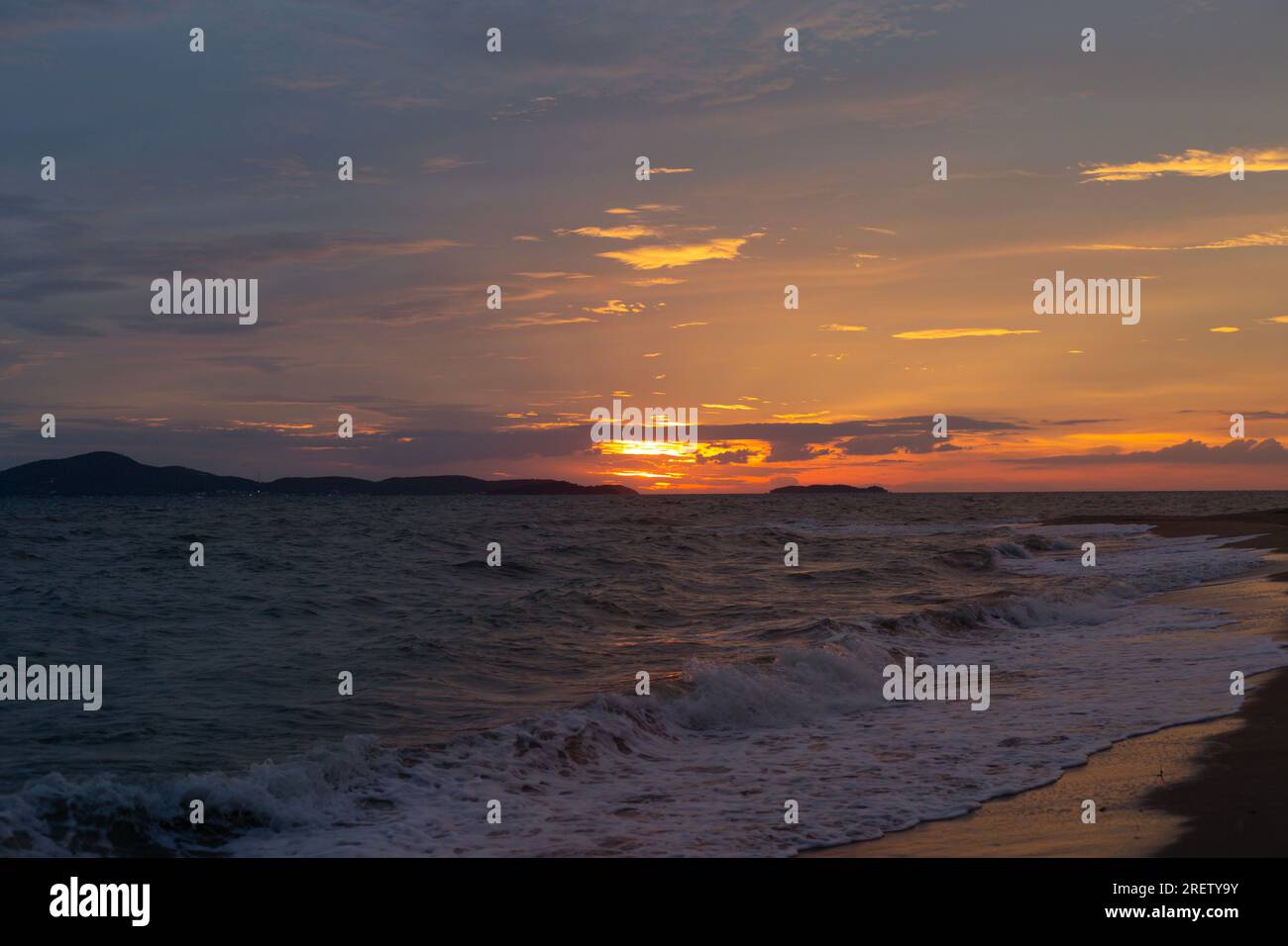 Raging Sea with Sunset Sky Background Stock Photo - Alamy