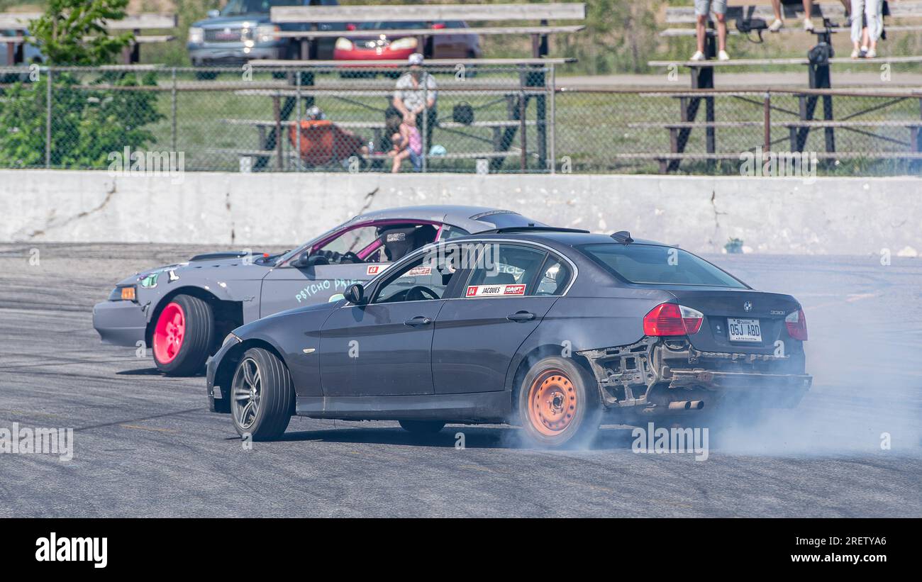 Car drifting auto racing event action with smoking tires - burning ...