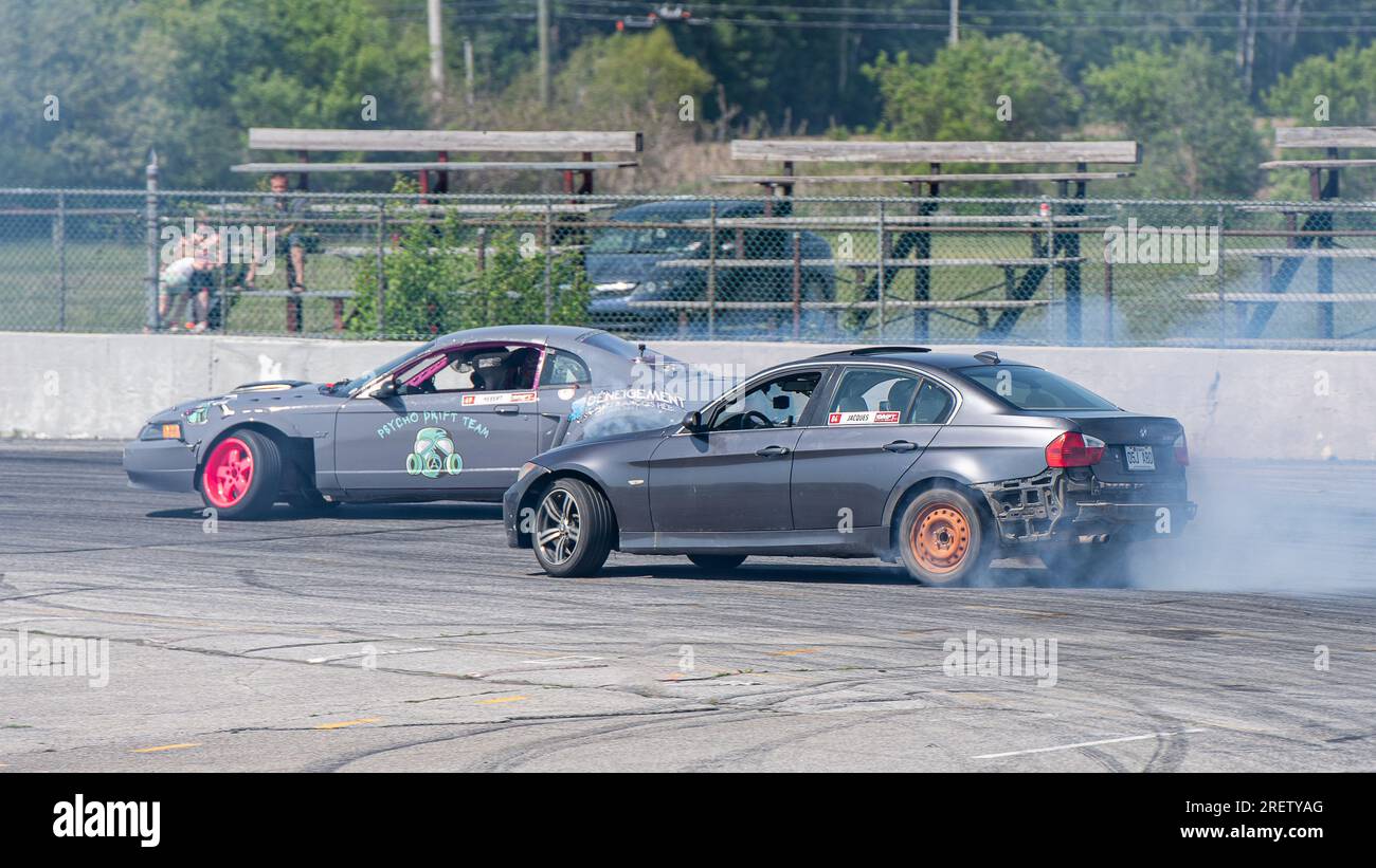 Car drifting auto racing event action with smoking tires - burning ...