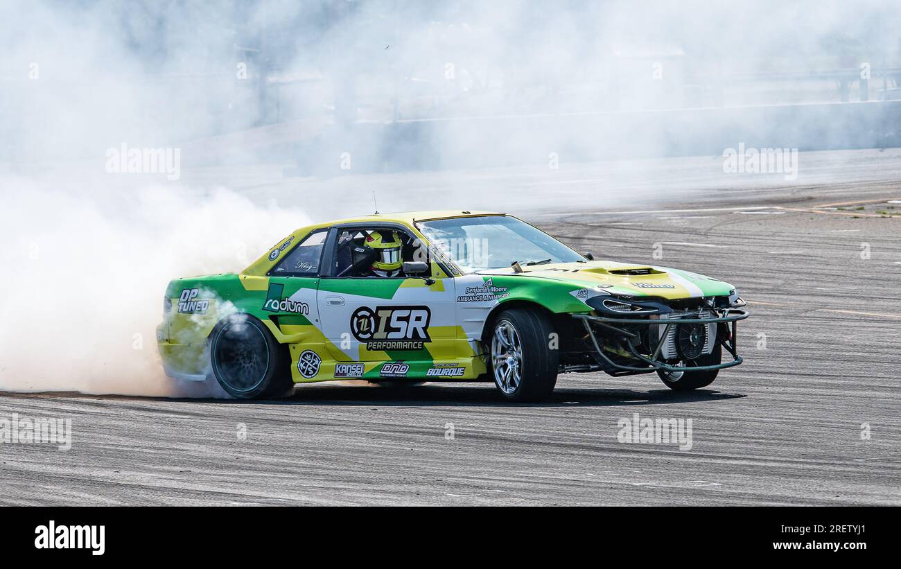 Car drifting auto racing event action with smoking tires - burning ...
