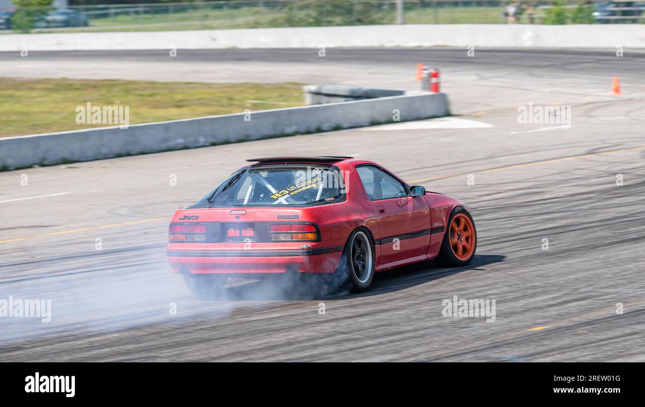 Car drifting auto racing event action with smoking tires - burning ...