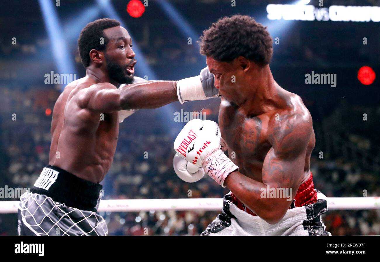 Terence Crawford, left, connects with a punch that sent Errol Spence Jr ...