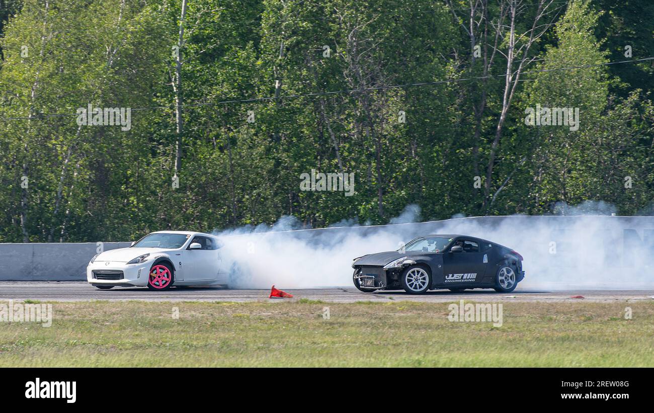 Car drifting auto racing event action with smoking tires - burning ...