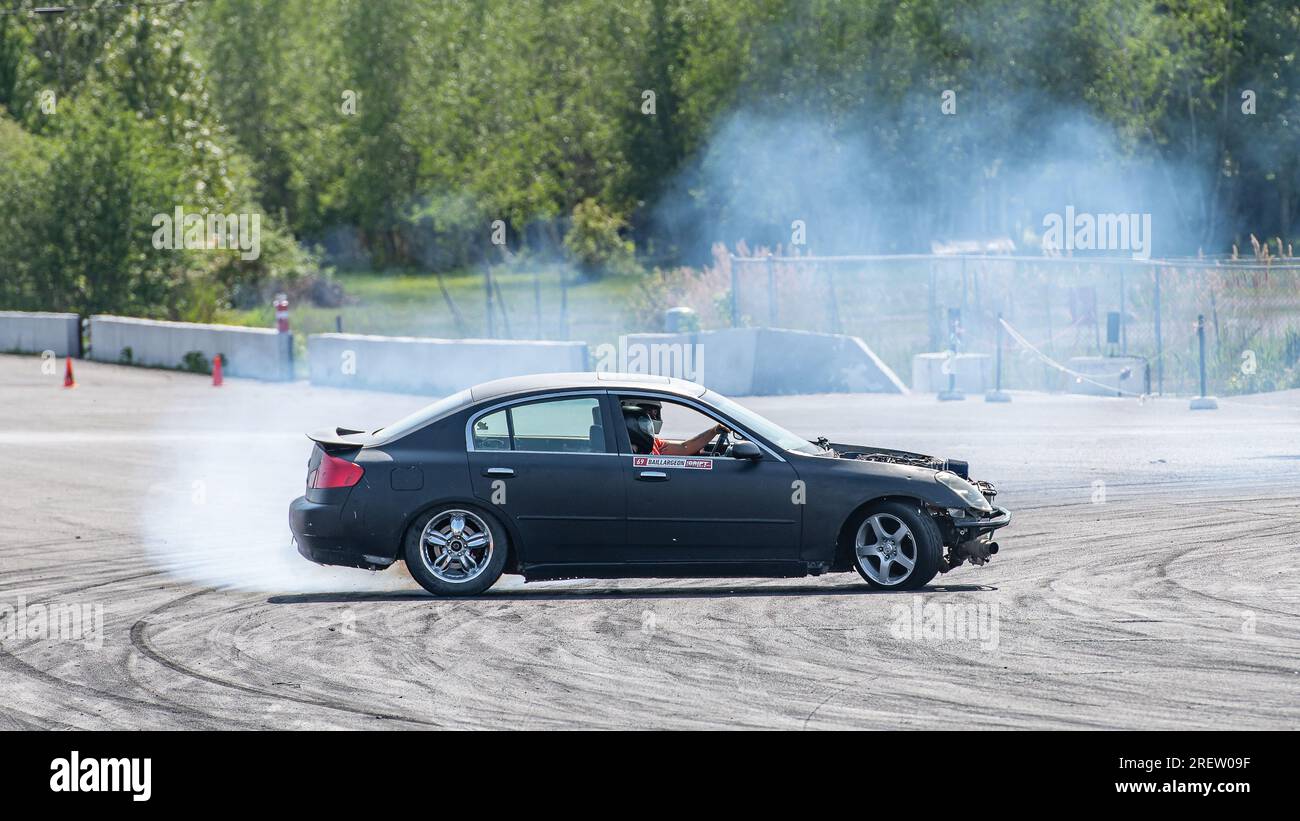 Car drifting auto racing event action with smoking tires - burning ...