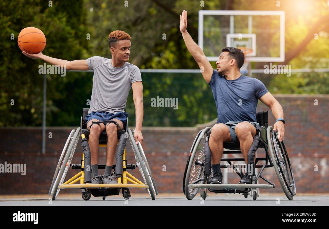 Sports, basketball and men in wheelchair on court for training ...