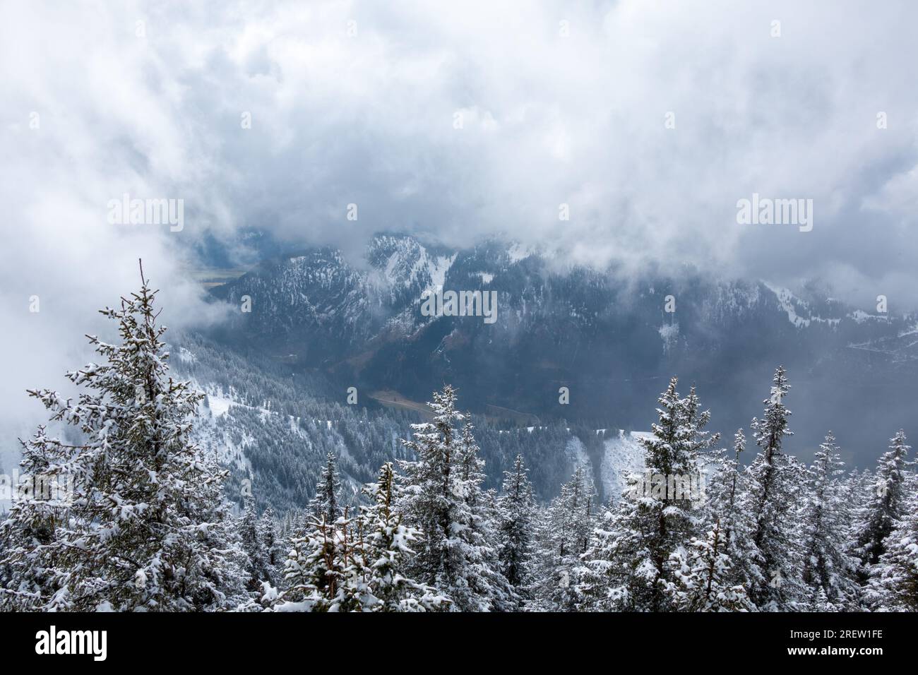 Wintry view with mysterious clouds from the summit of Mount Breitenberg ...