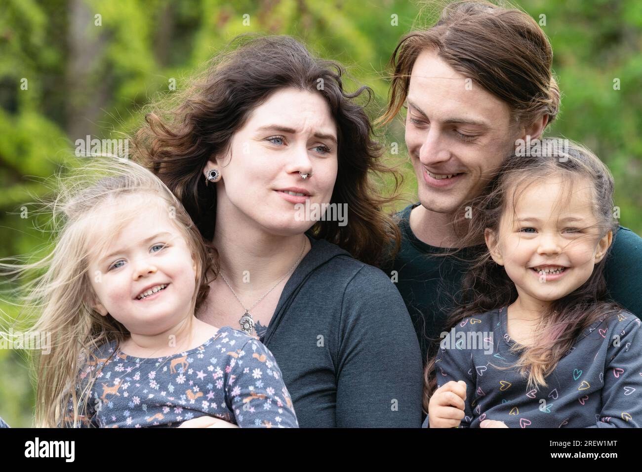 A family of four at a park Stock Photo - Alamy