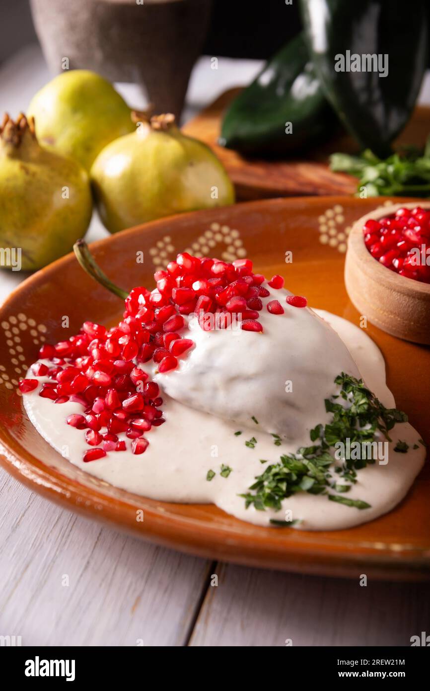 Chiles en Nogada, Typical dish from Mexico. Prepared with poblano chili ...