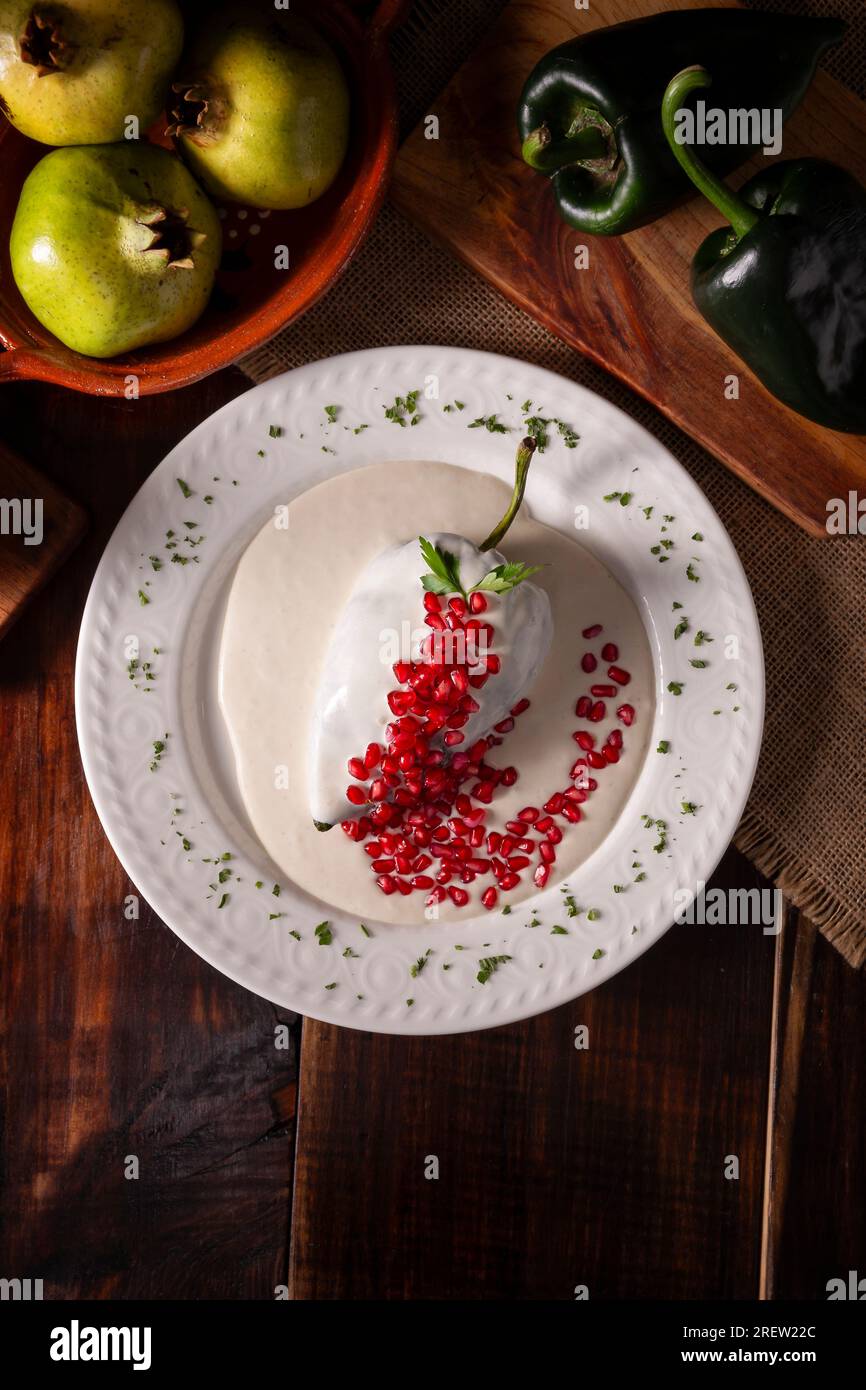 Chiles en Nogada, Typical dish from Mexico. Prepared with poblano chili ...