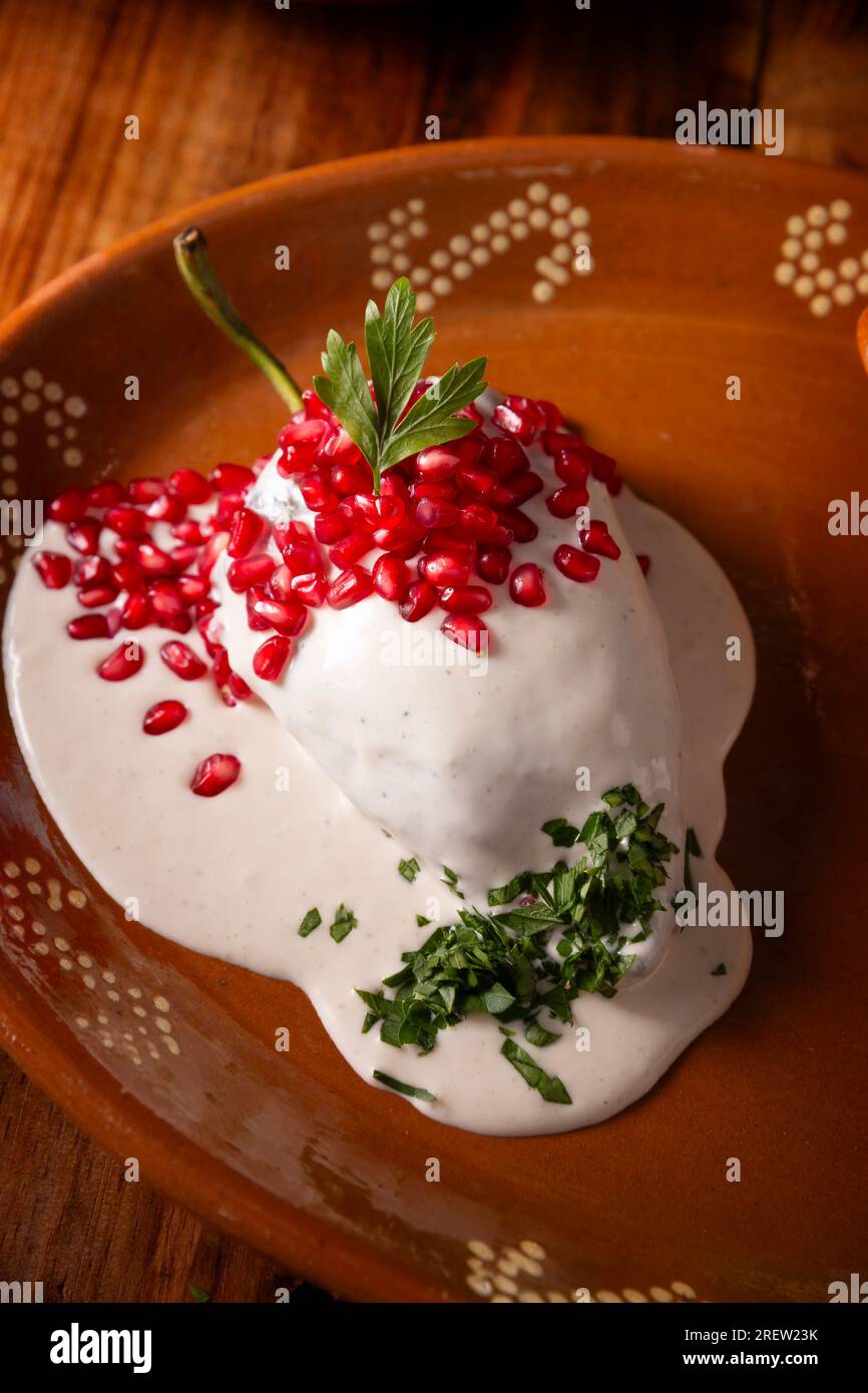 Chiles en Nogada, Typical dish from Mexico. Prepared with poblano chili ...