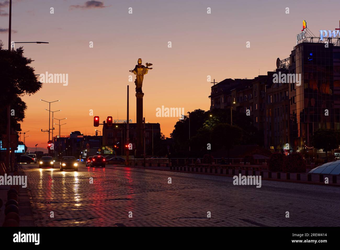 Statue of Sveta Sofia on a summers night with cars in the foreground ...