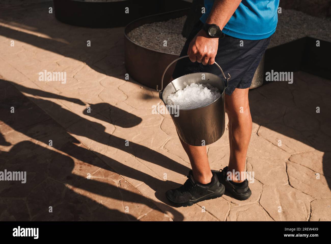 Person holding bucket hi-res stock photography and images - Alamy
