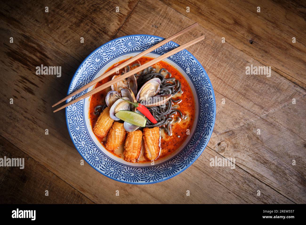 Typical hot ramen dish with fish broth in a bowl with black noodles ...