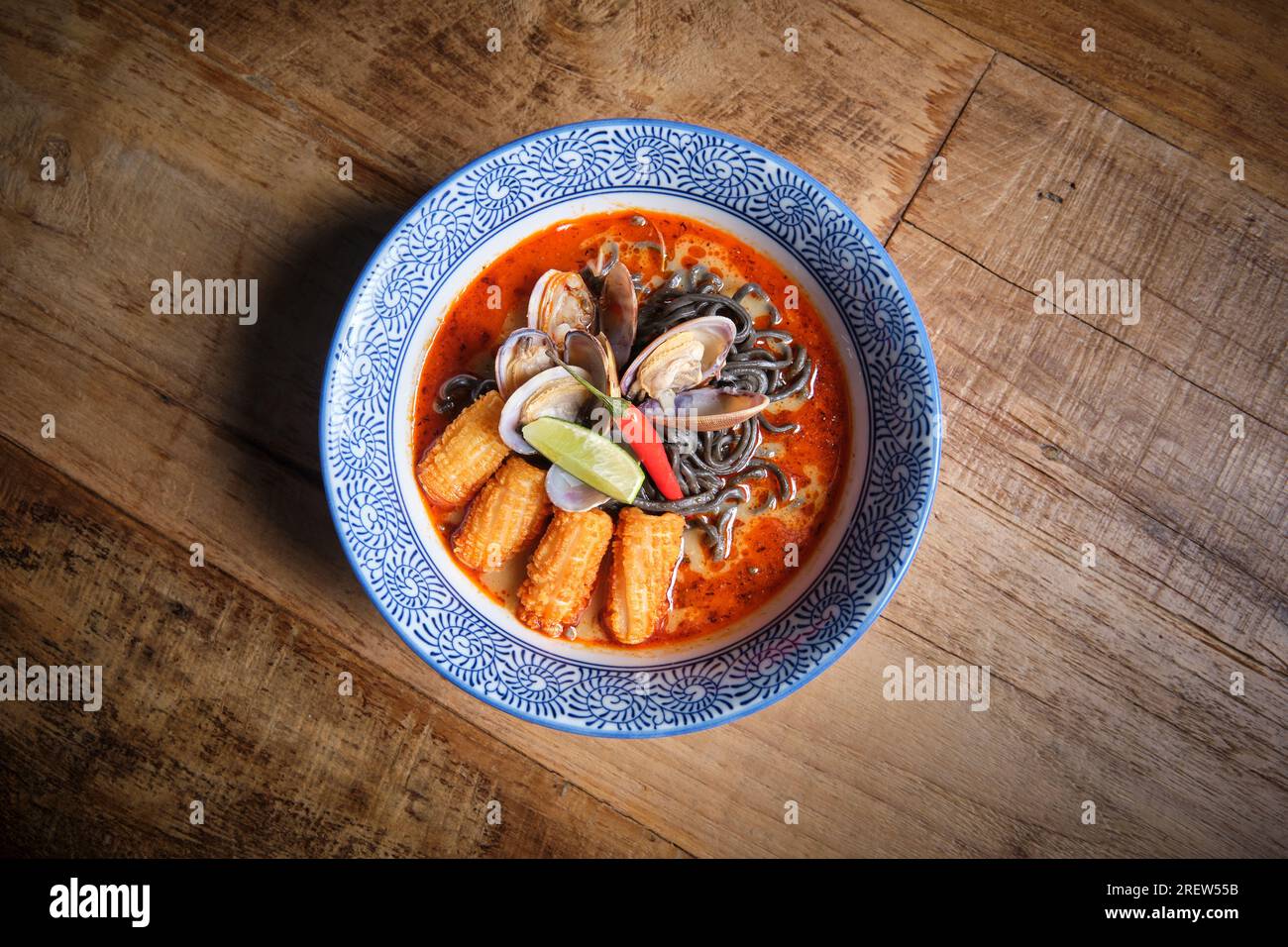 Typical hot ramen dish with fish broth in a bowl with black noodles ...
