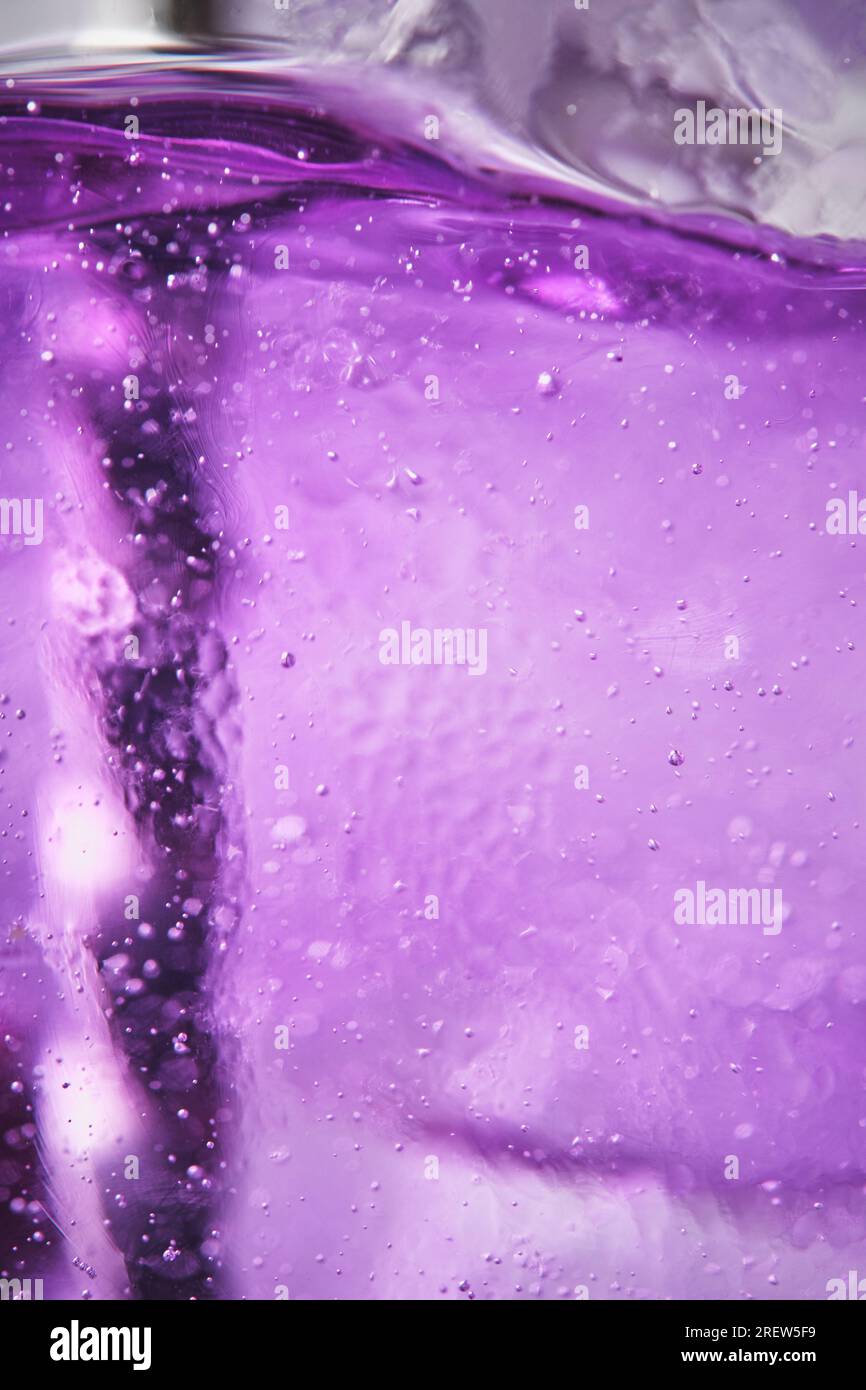 Ice with lilac colored tonic Stock Photo - Alamy