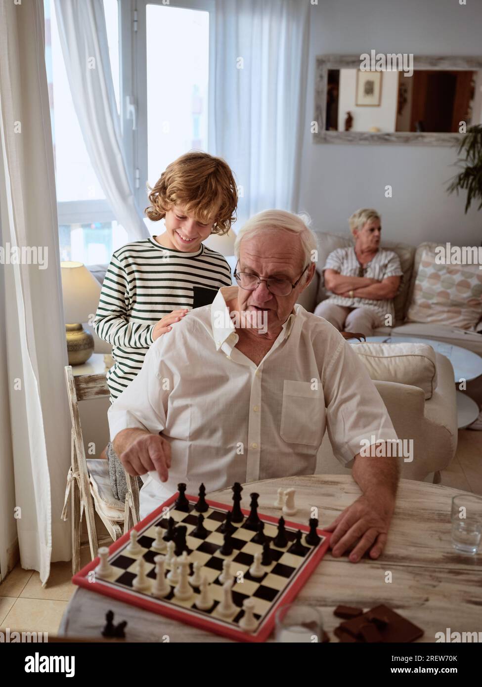 Grandfather boy playing game chess hi-res stock photography and images ...
