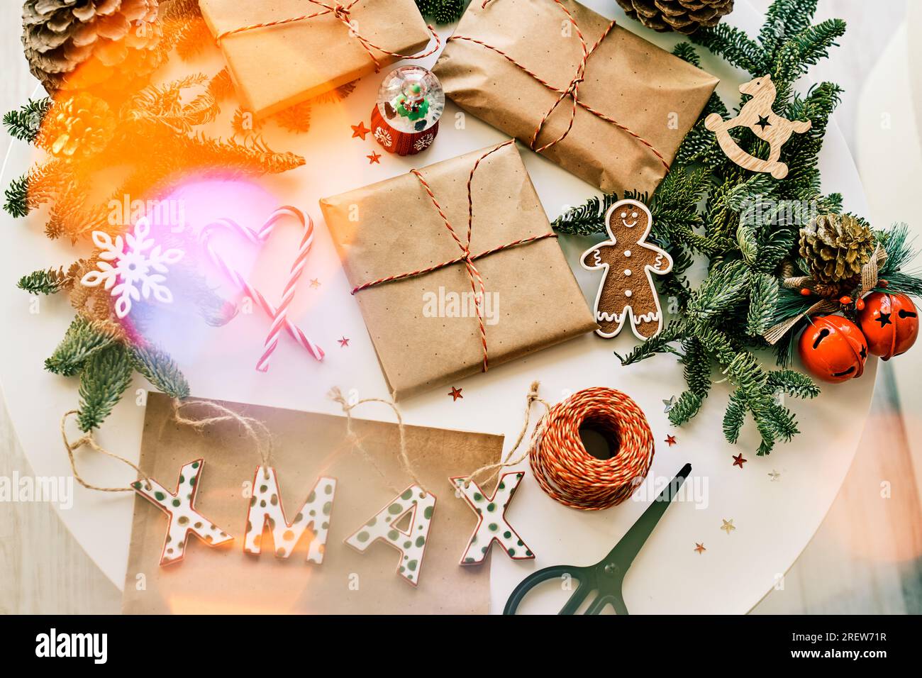 From above of wrapped Christmas presents placed on round table with ...
