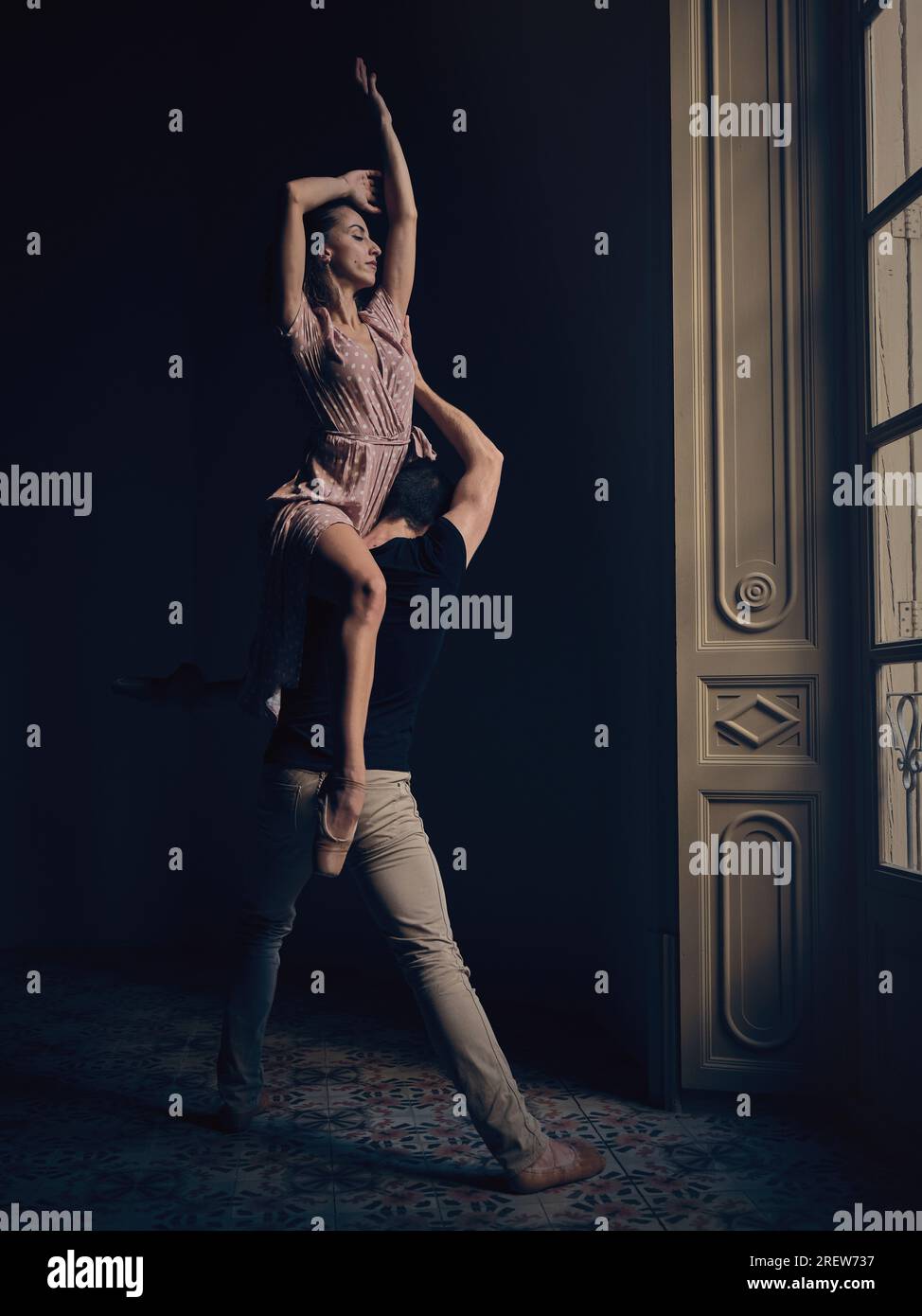 Full body of ballerina sitting on shoulder of faceless male dancer ...
