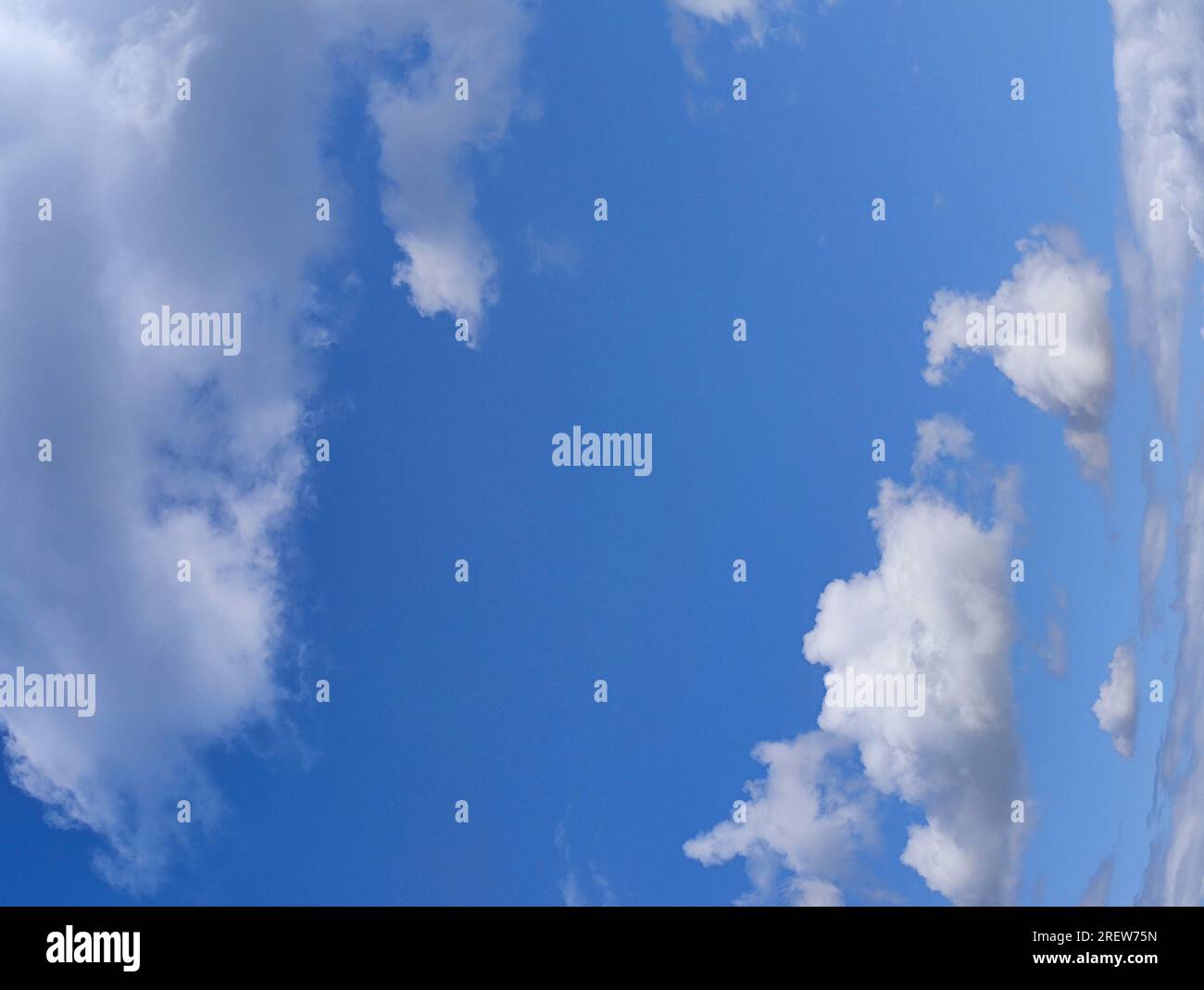 Unusual distorted white cloudscape over blue sky background Stock Photo ...