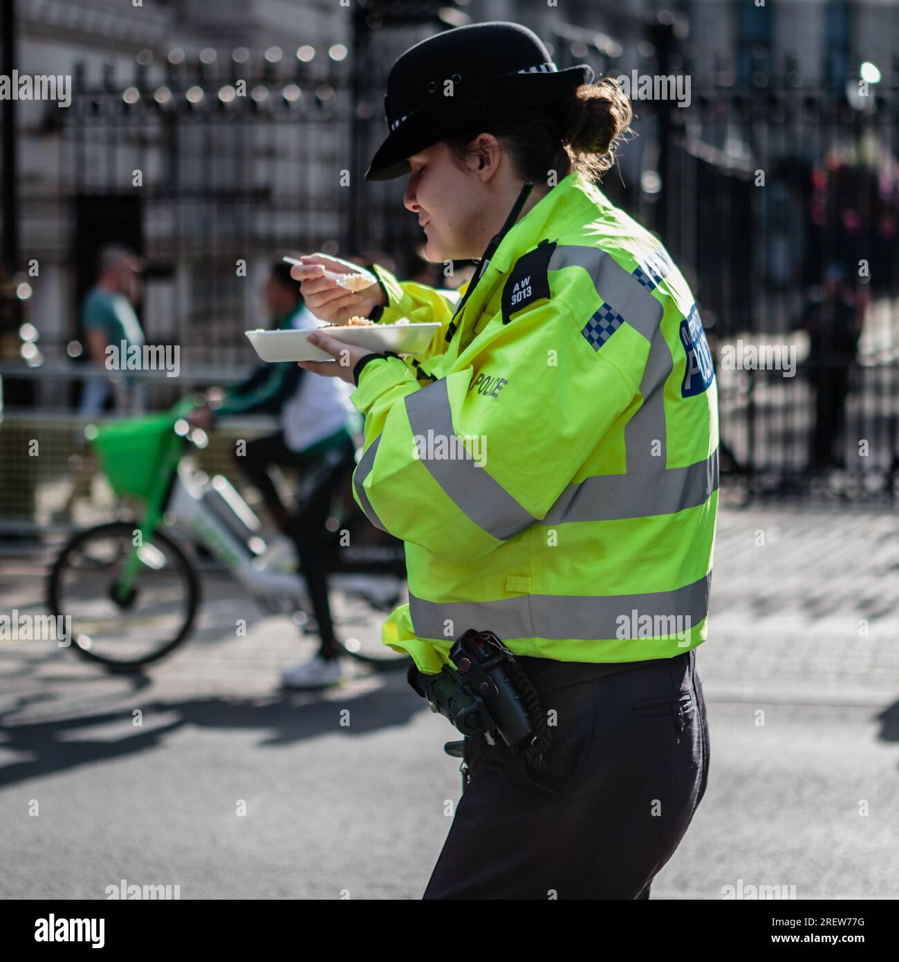 A policewoman enjoys a meal at the commemoration of Imam Hussain, the ...