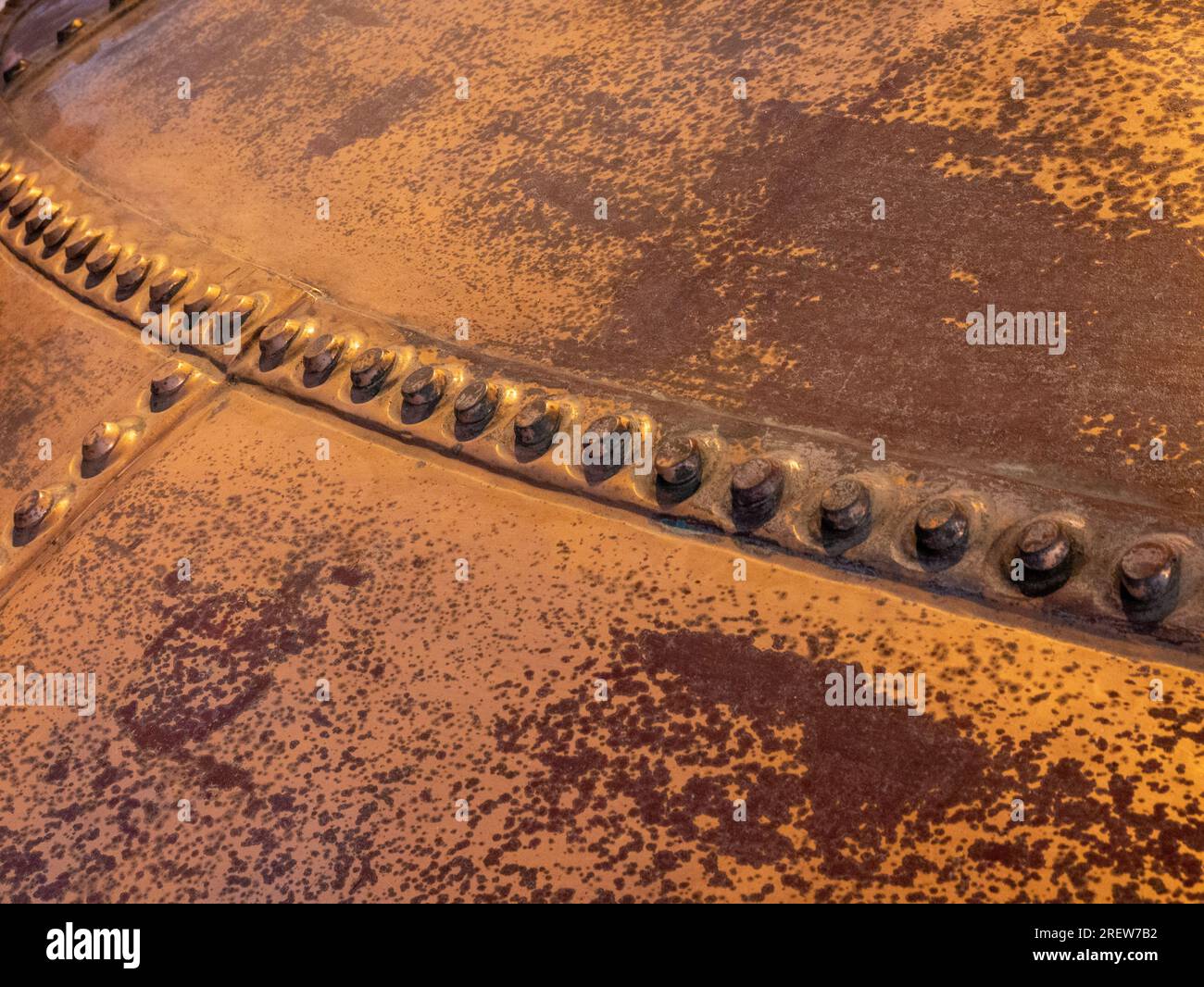 Metal background, old copper wall with rivets Stock Photo - Alamy