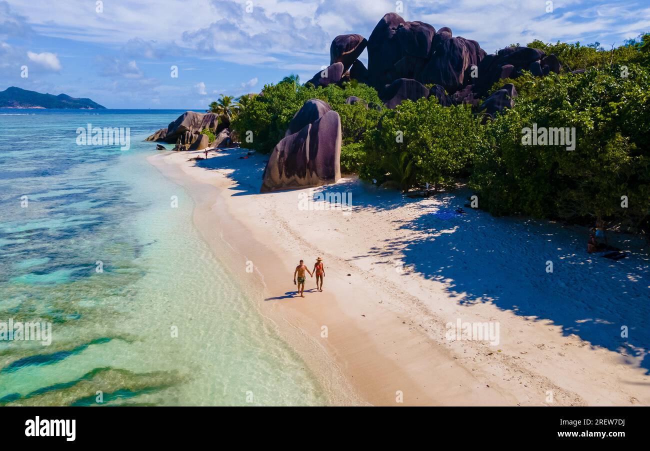 Anse Source d'Argent, La Digue Seychelles, a couple of men and women on ...