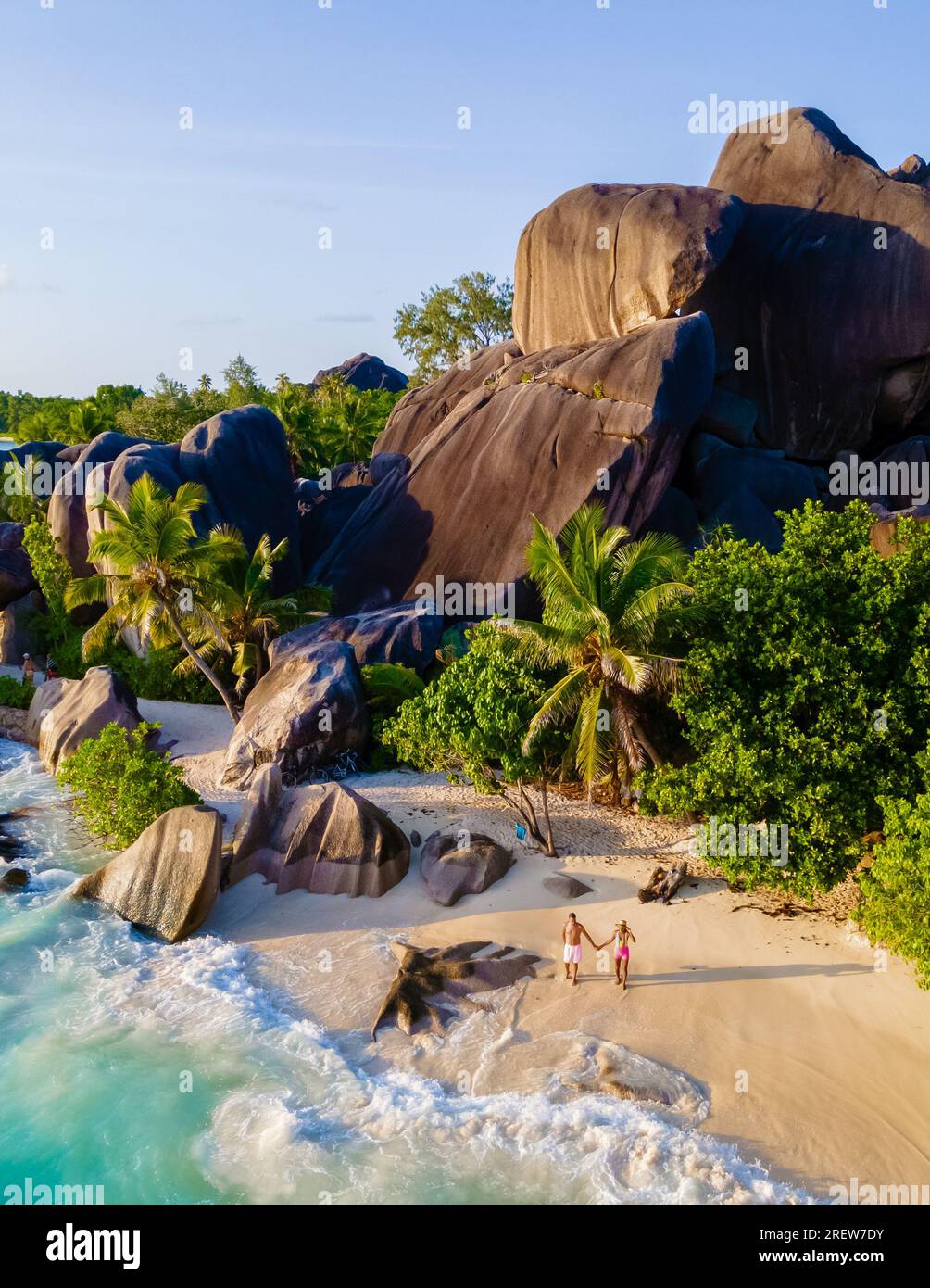 Anse Source d'Argent, La Digue Seychelles, a young couple of men and ...