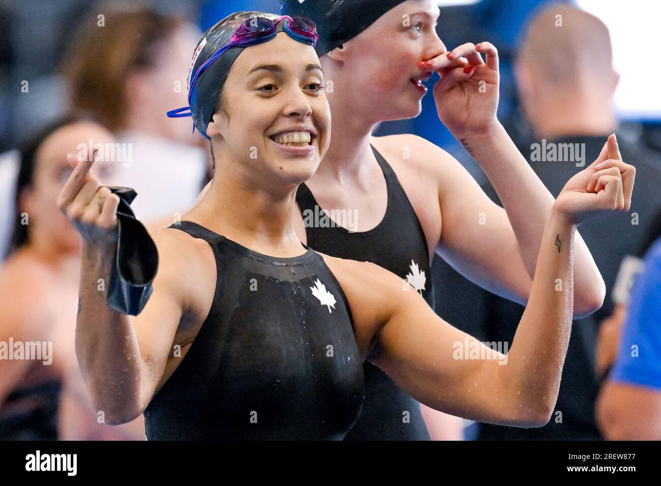 Fukuoka, Japan. 30th July, 2023. Athletes of team Canada react after ...