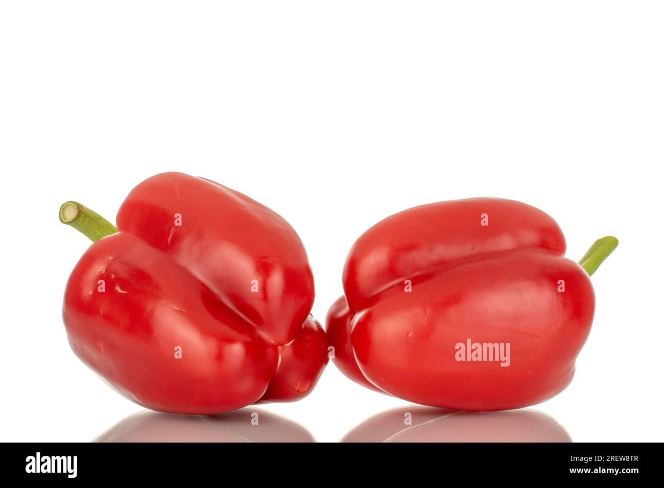 Two red bell peppers, macro, isolated on white background Stock Photo ...