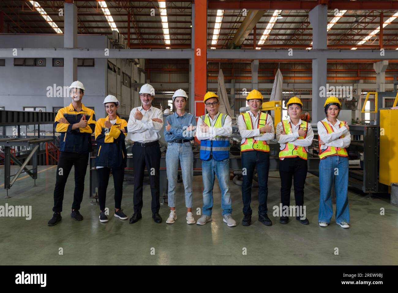 Industrial teamwork. Professionals donning safety hard hats standing ...