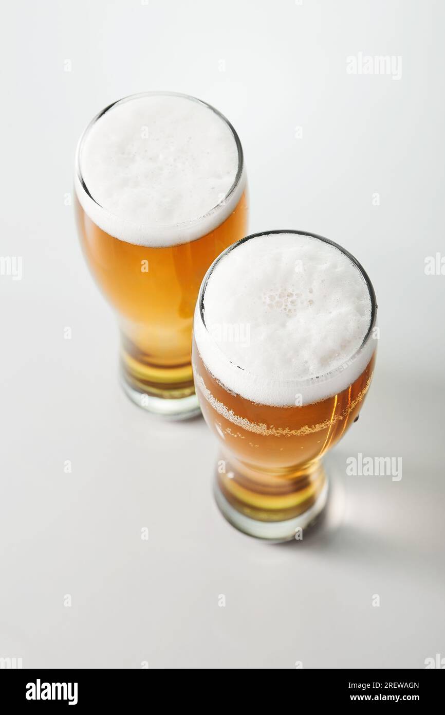 Fizzy yellow beer poured hi-res stock photography and images - Alamy