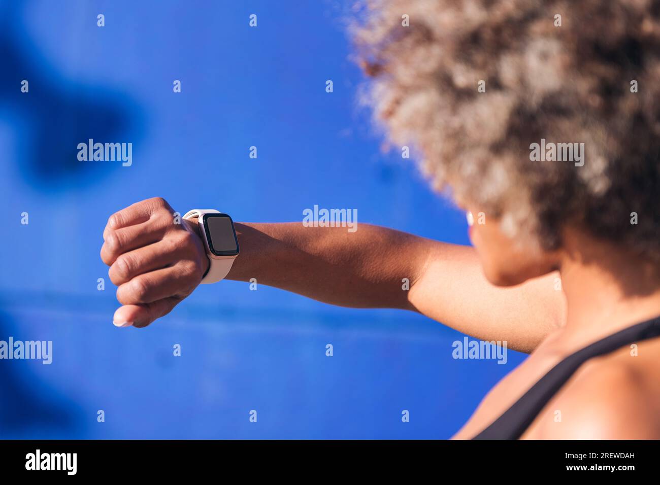 Unrecognizable athlete woman checking hi-res stock photography and ...