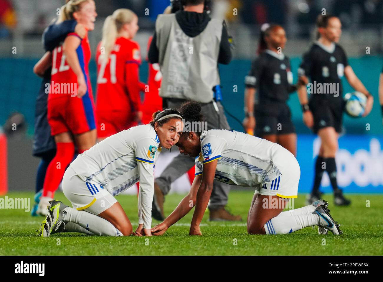 Philippines' Hali Long, left, and Dominique Randle react at the end of ...