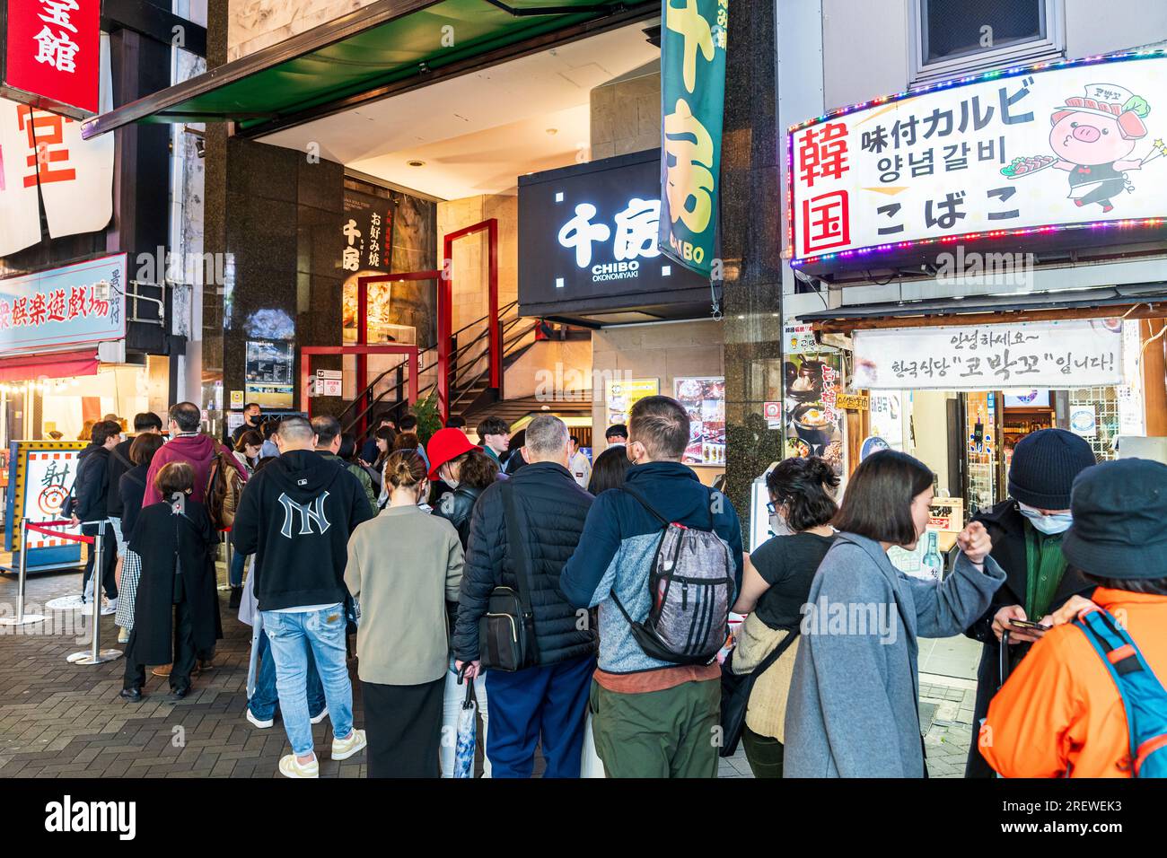 Long line of mainly Japanese people queuing outside the popular Chibo ...