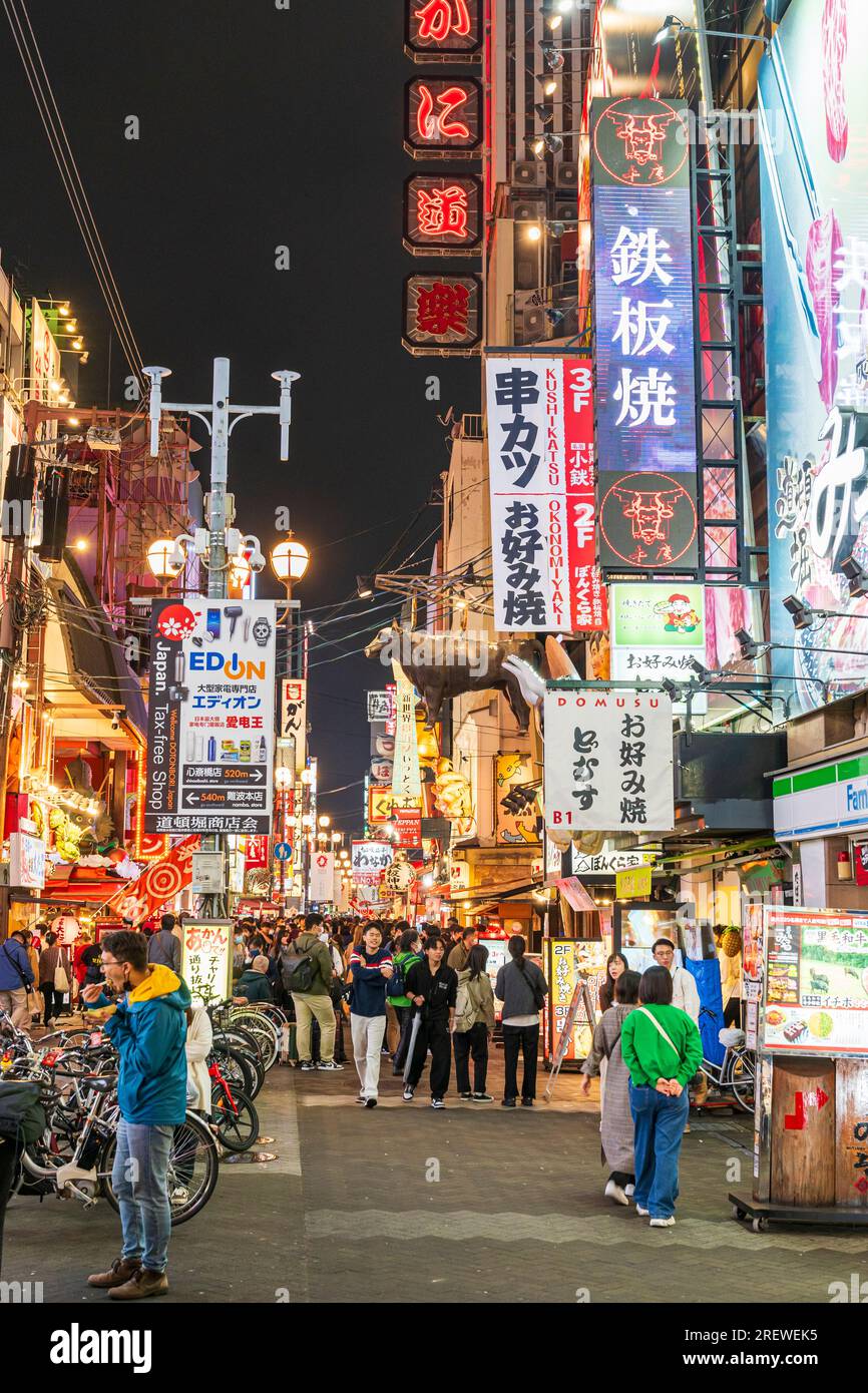 Crowds of tourists walking through the popular Dotonbori street in ...