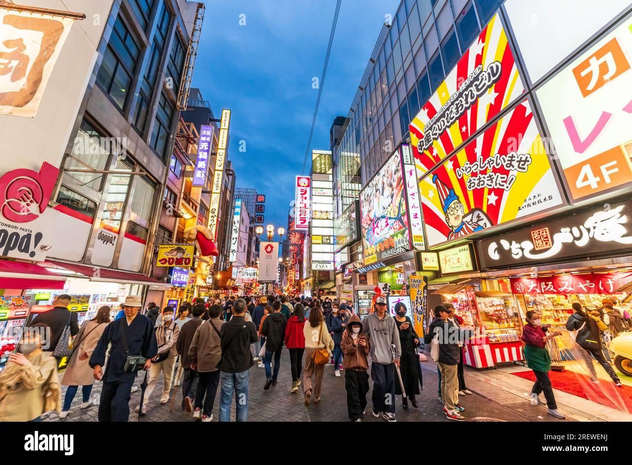 Crowds of tourists walking through the popular Dotonbori street in ...