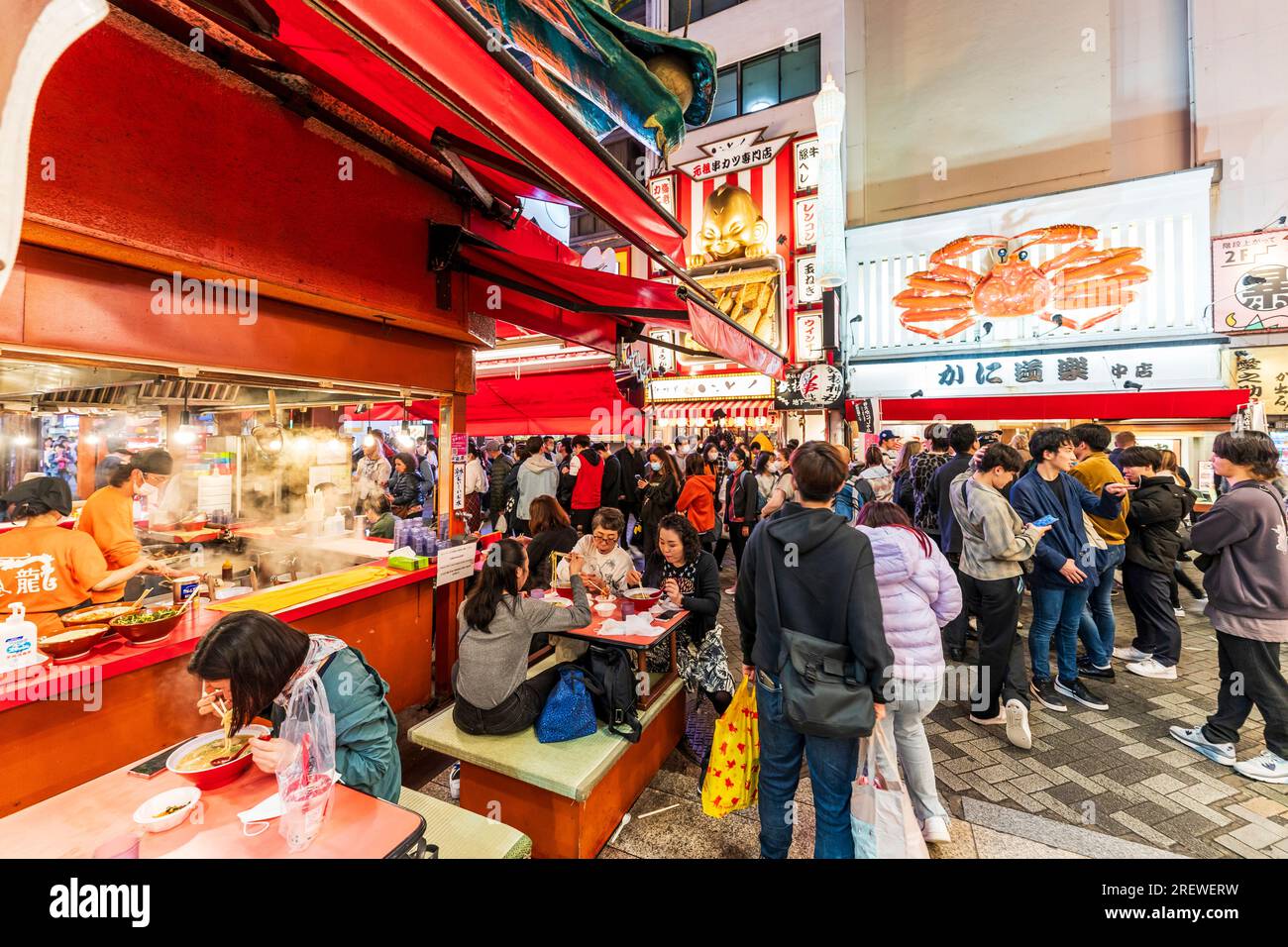 Diners sitting at tables eating noodles at the poplar Kinryu ramen and ...