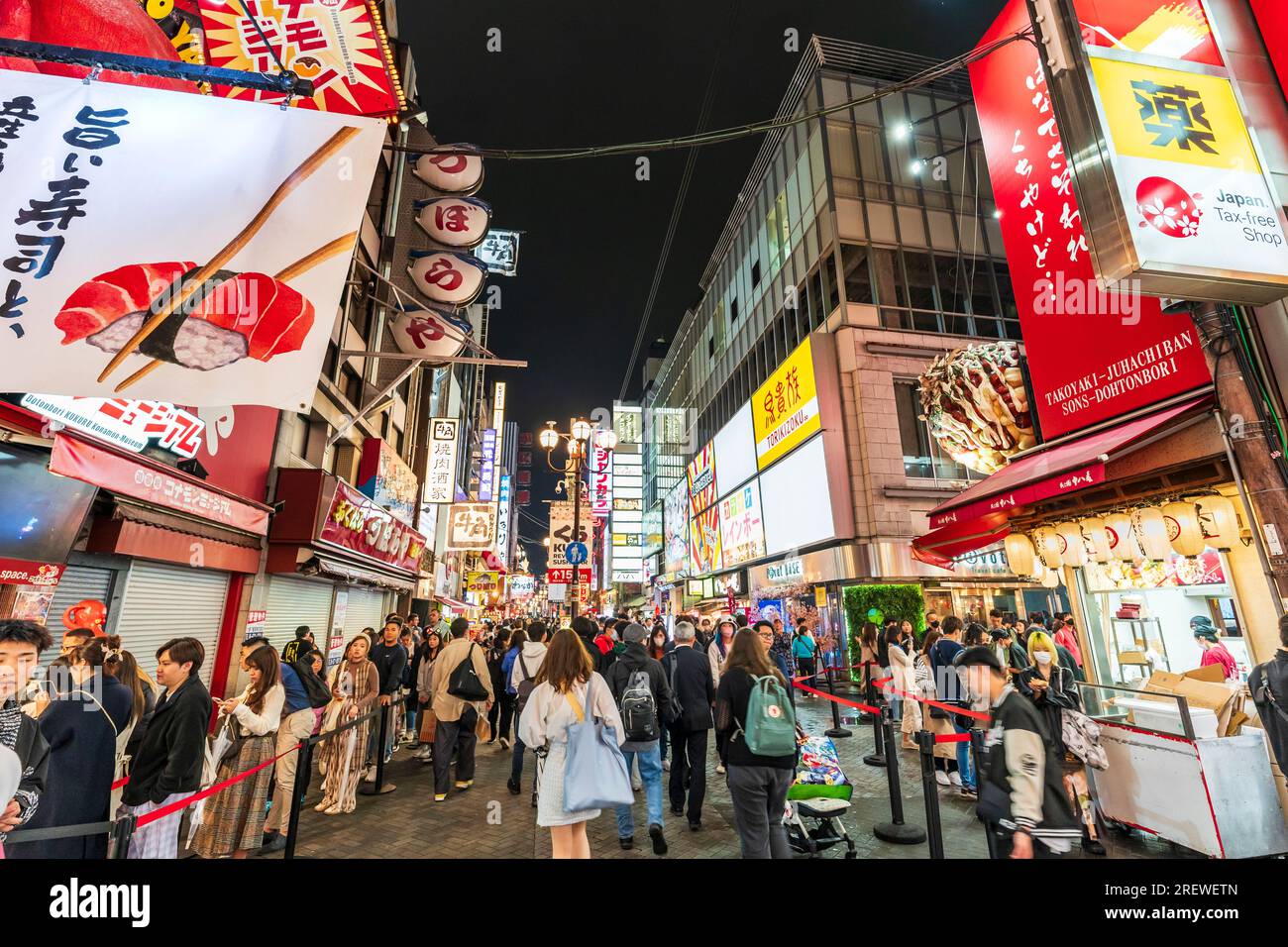 Long line of people queuing at night for the popular Konamon Museum ...