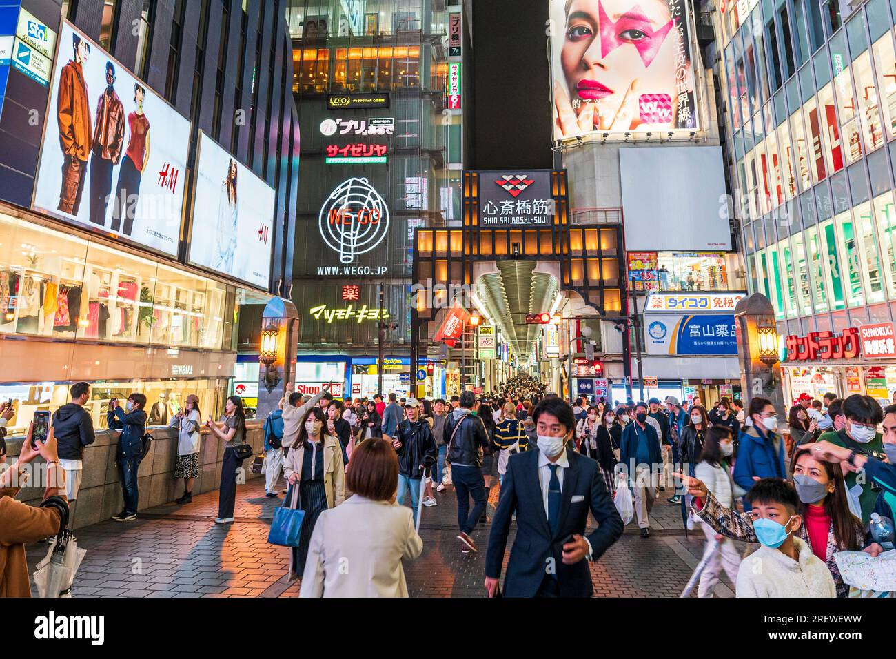 Night time view from the Ebisu bridge at Dotonbori, Osaka, of the entrance to the very long ...