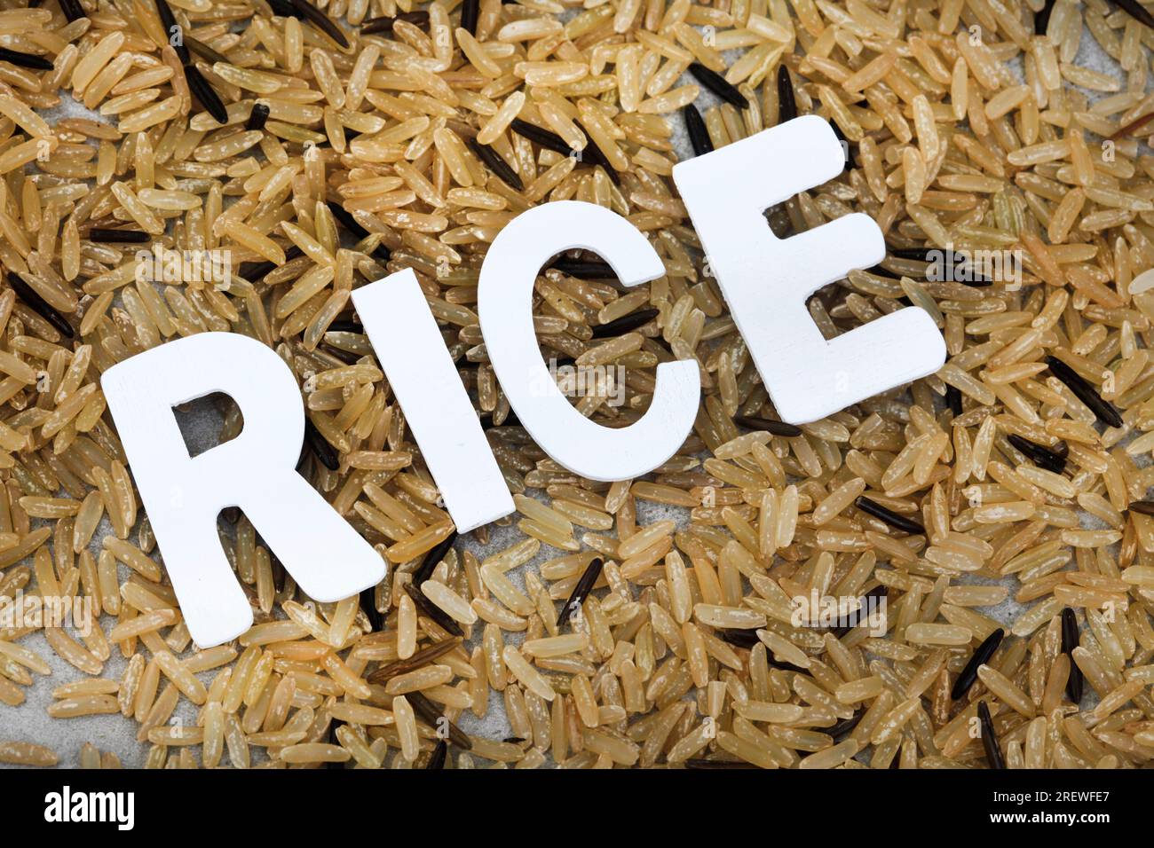 Rice written in white lettering on a pile of rice Stock Photo - Alamy