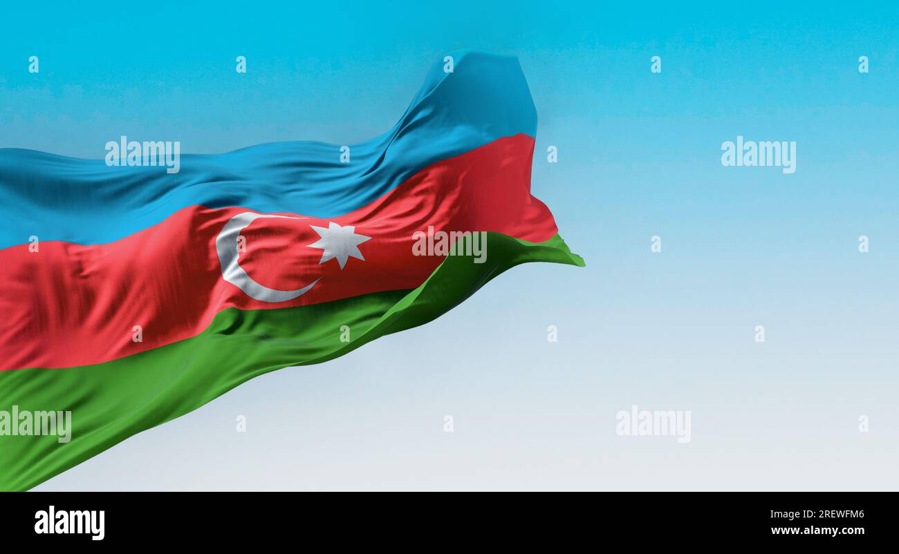 The national flag of Azerbaijan waving in the wind on a clear day ...