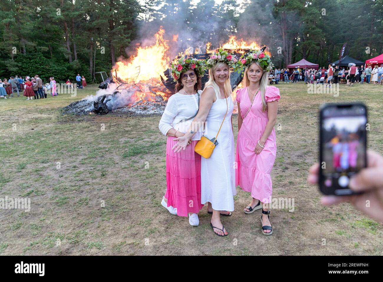 Women with flowers in her heads celebrating Jaanipaev, midsummer day ...