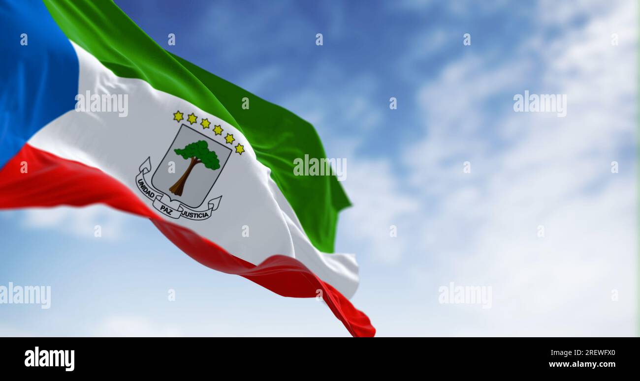 National flag of Equatorial Guinea waving in the wind on a clear day ...