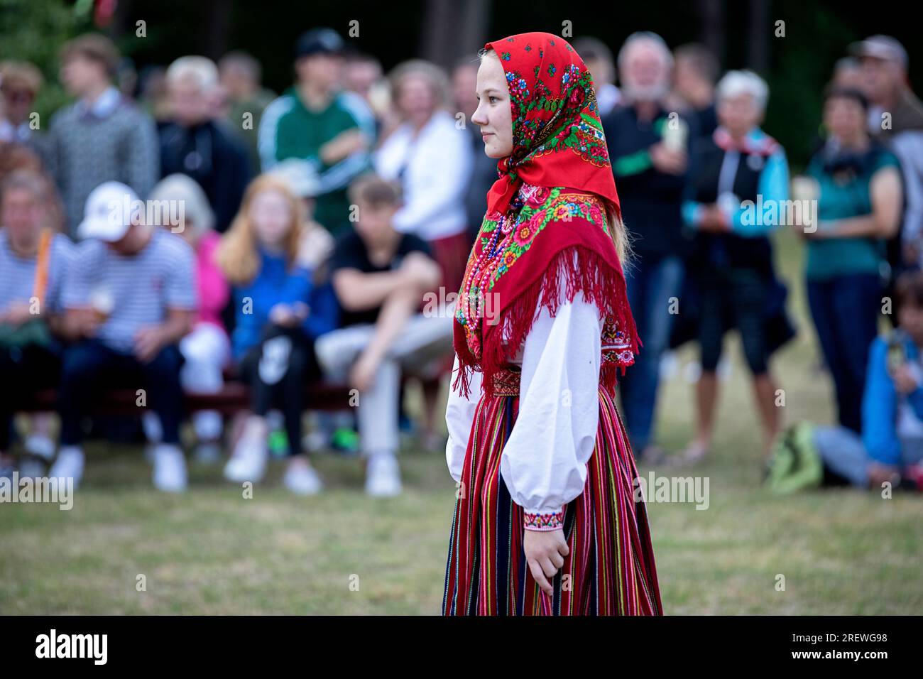 Woman in traditional estonian clothes dancing and celebrating estonian ...