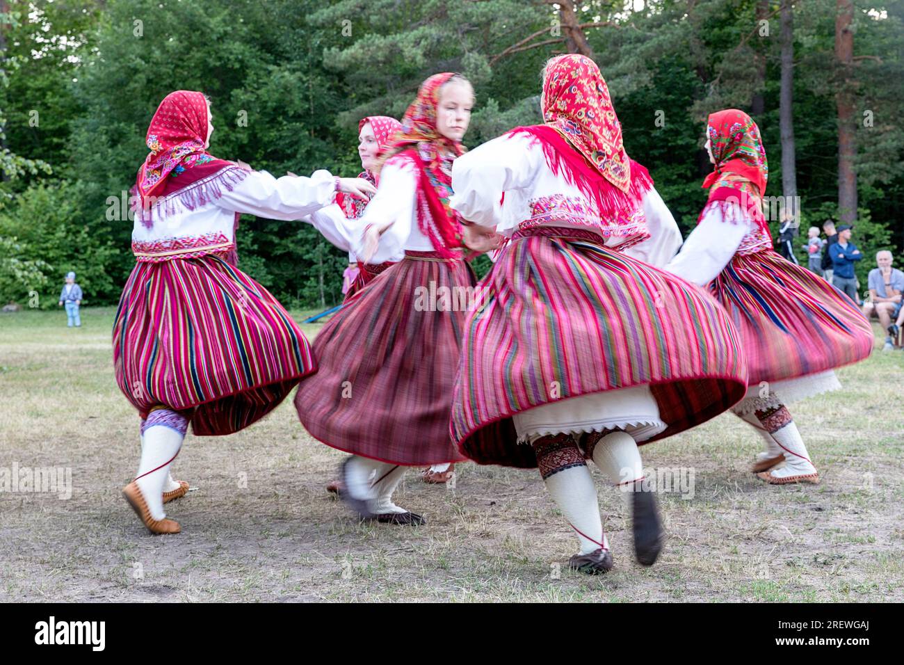 Girls in traditional estonian clothing dancing and celebrating estonian ...