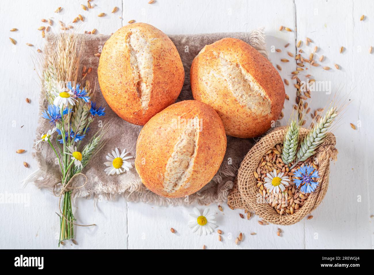 Healthy buns baked with organic wheat and flowers. Rolls surrounded by ...