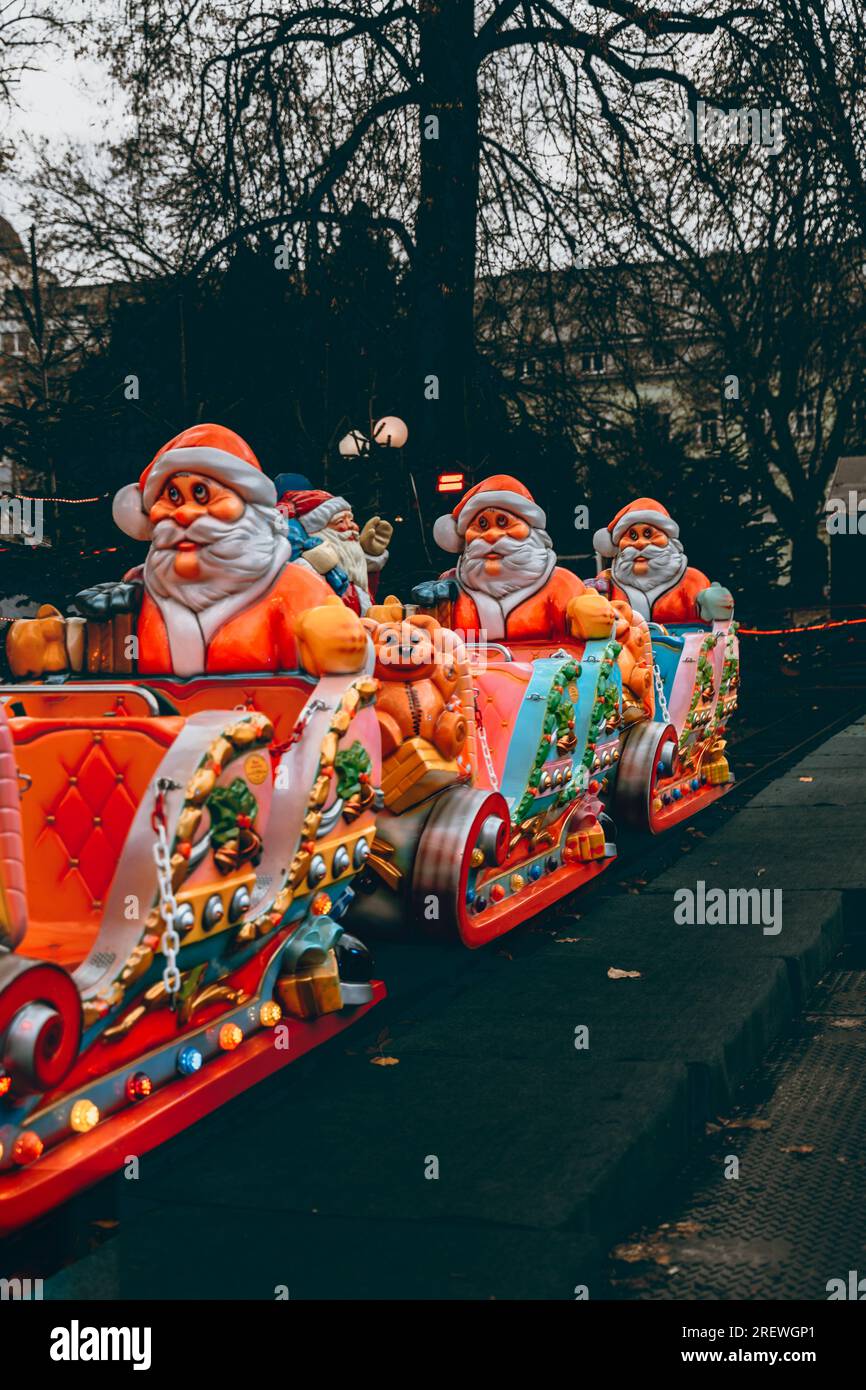 Festive Christmas market in Linz, Austria with merry Santa ride for ...