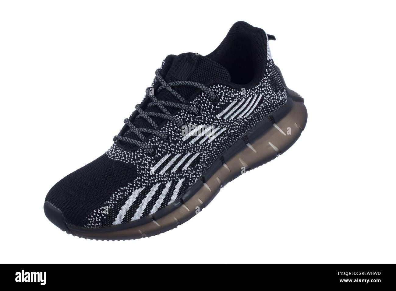 Black rag sneaker with gray stripes on a white background Stock Photo ...